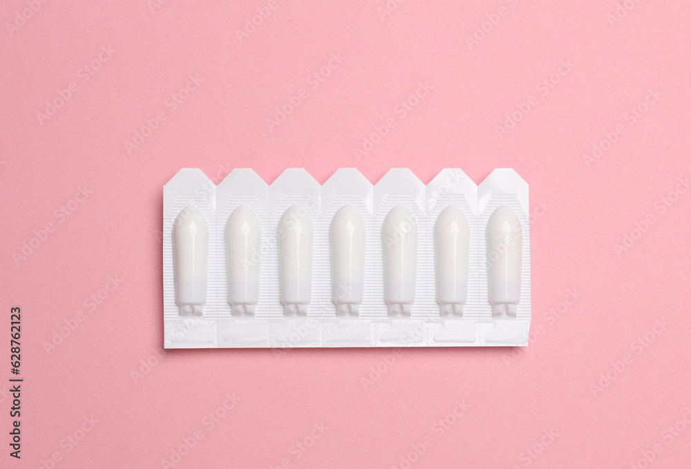 Blisters of vaginal suppositories on a pink background Stock Photo ...