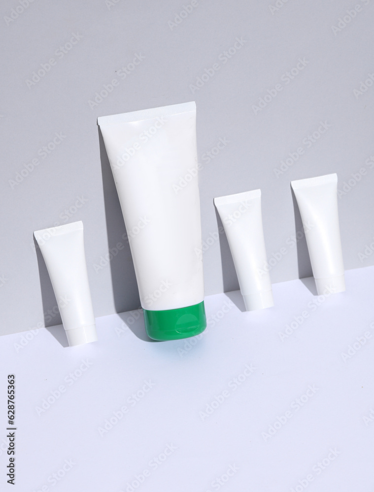White cream tubes on white background with shadow. Creative beauty ...