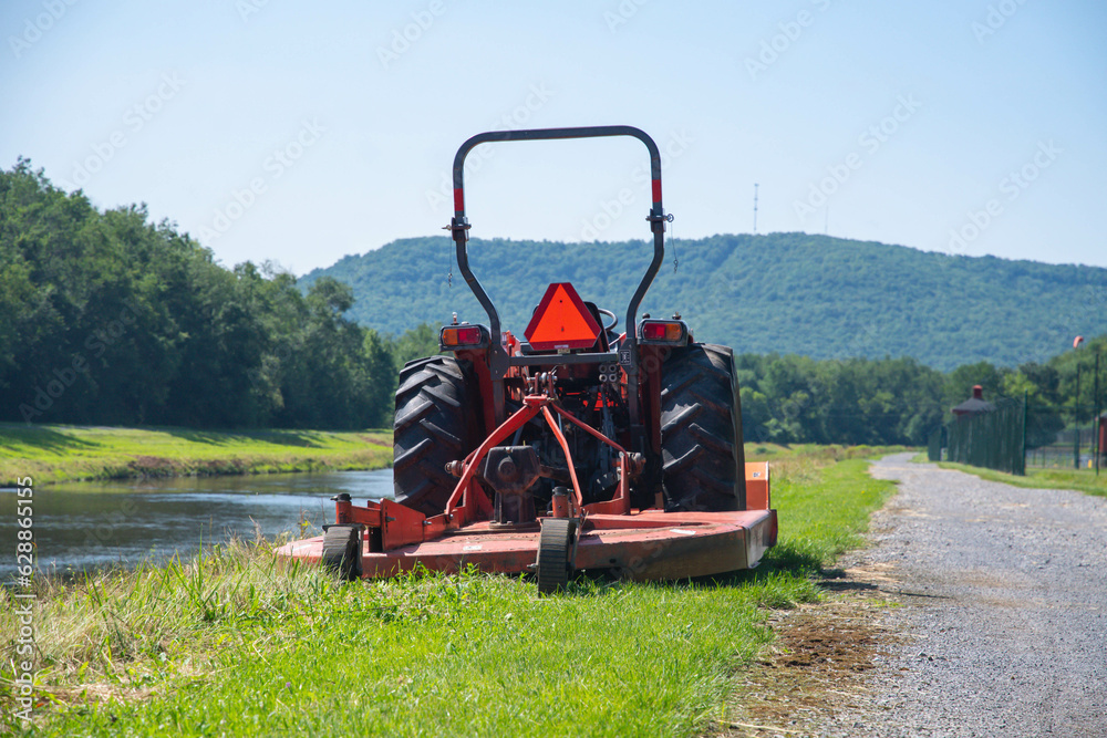 Grass cutting tractor park service and maintenance copy space ...