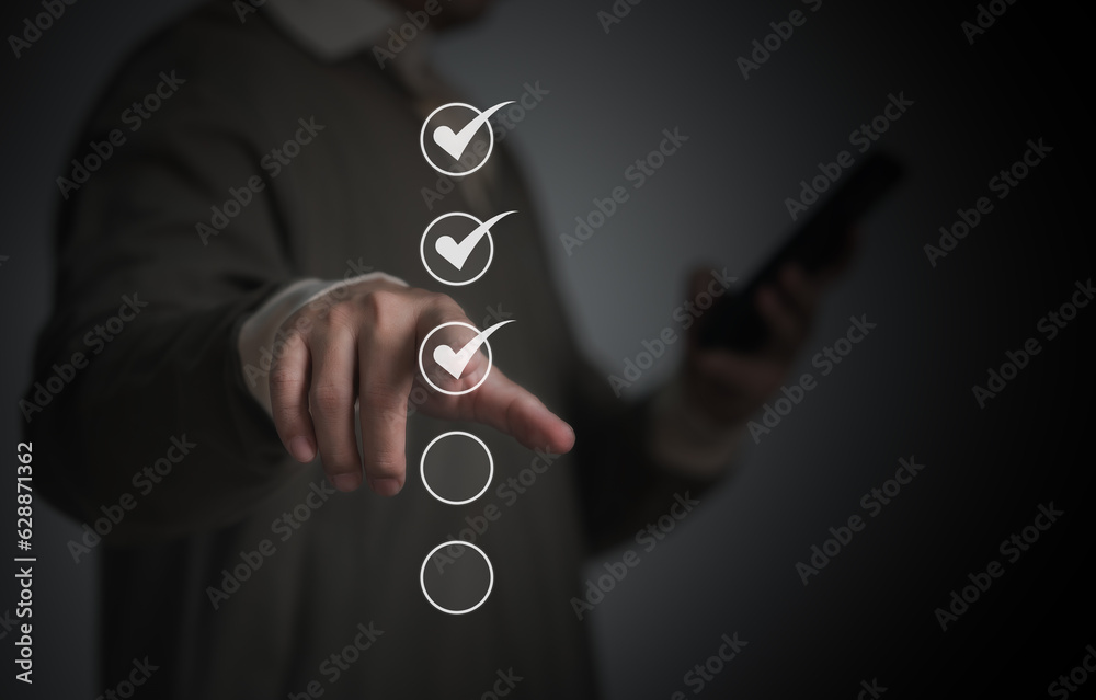 Performance checklist concept : businessman using finger with mobile ...