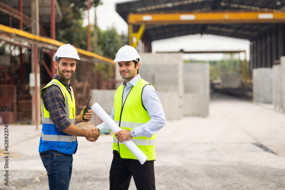 Heavy Industry Engineers teamwork. Two builder and construction worker ...