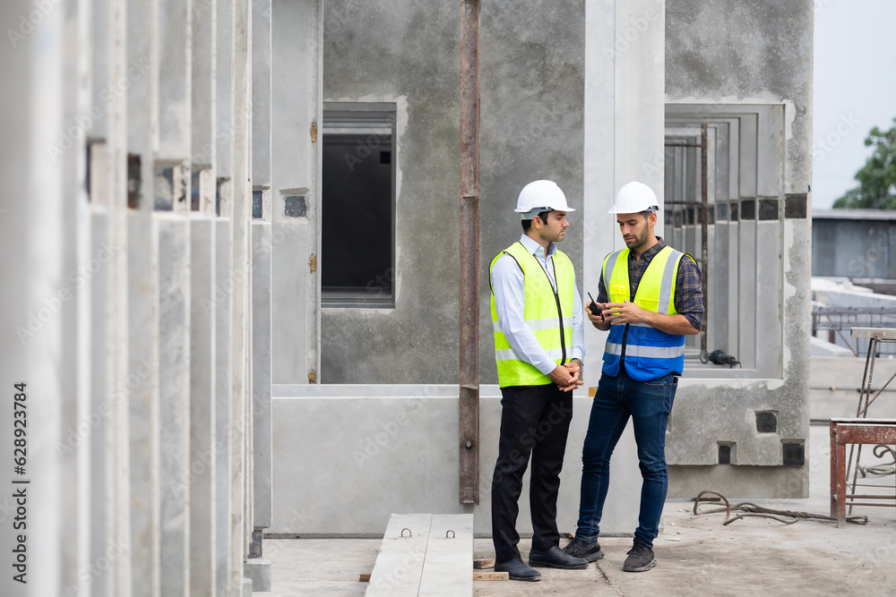 Heavy Industry Engineers teamwork. Two builder and construction worker ...
