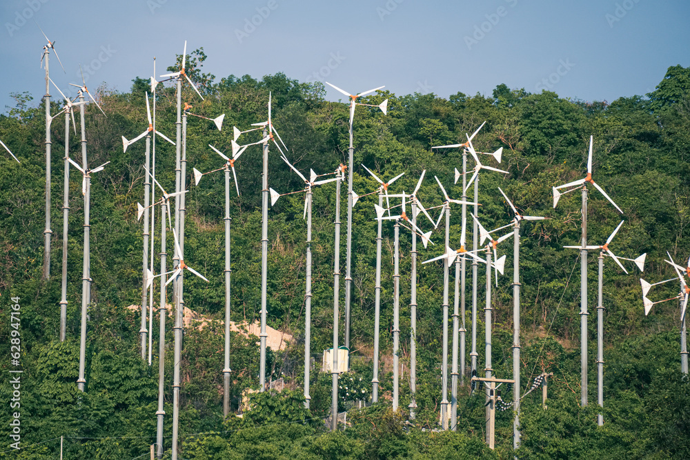 beautiful green view of windmill farm providing eco-friendly energy ...