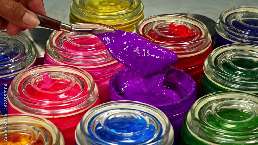 Use a trowel to stir the purple mass in a rotating flask..Stirring the ...