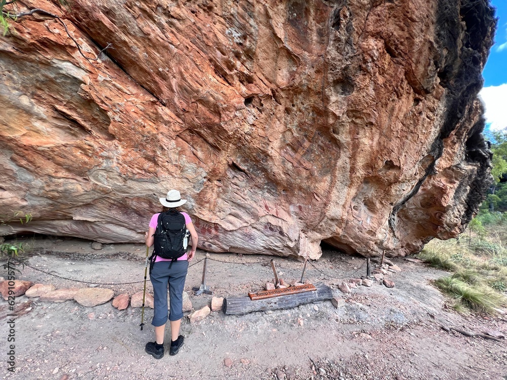 Photo & Art Print Australian woman look at Indigenous Australian rock ...