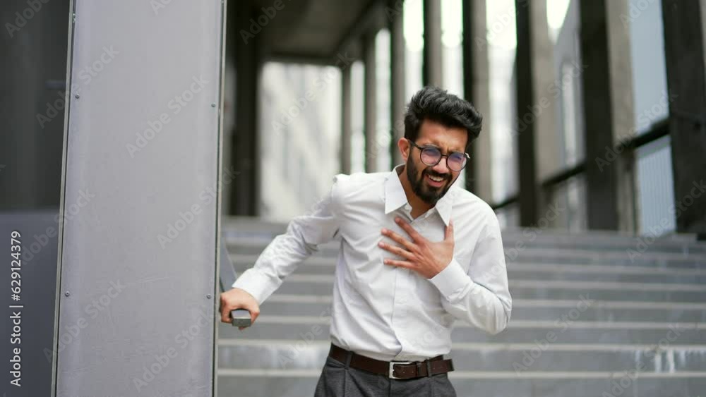 A businessman suffered a heart attack while walking down the stairs of ...