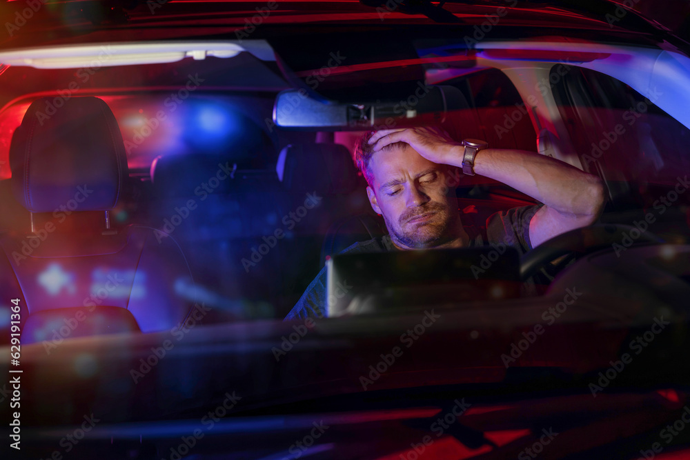 Desperate Man Sitting Inside A Car After Being Stopped By Police For