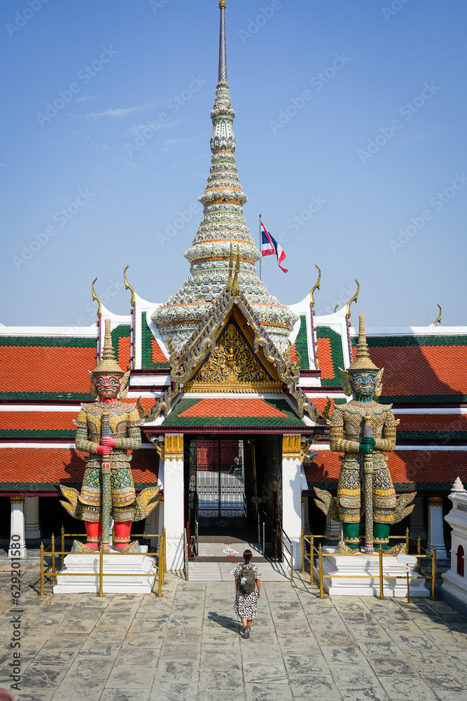 girl entering a temple gate in Southeast Asia Stock Photo | Adobe Stock