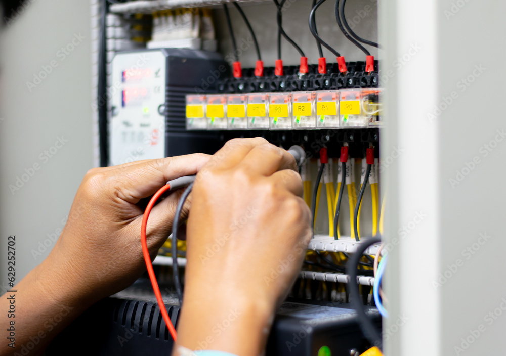 Electrician work tester measuring voltage and current of power electric ...