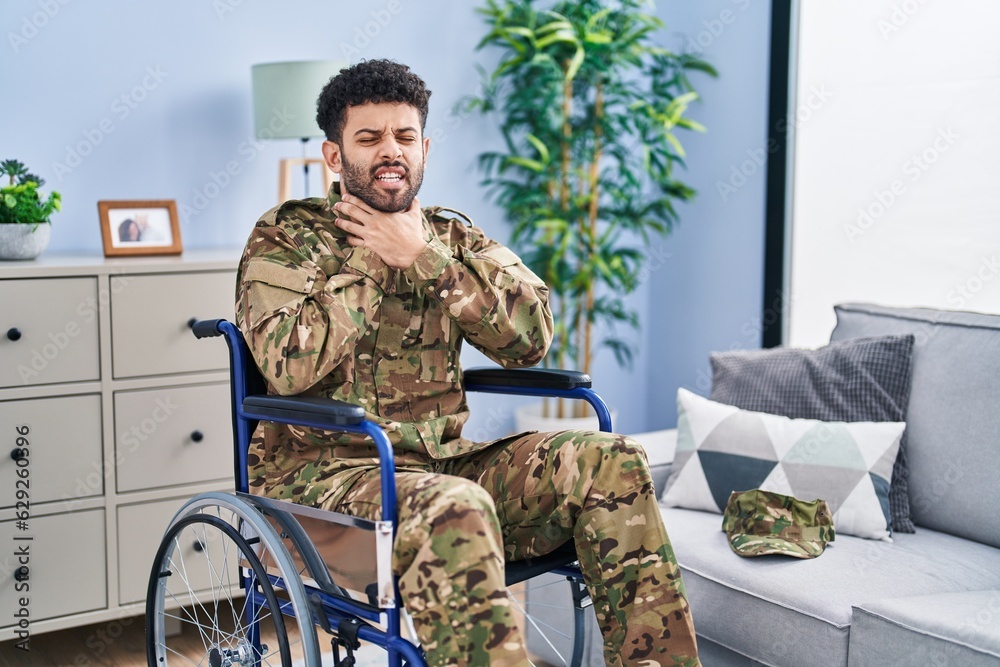 Arab man wearing camouflage army uniform sitting on wheelchair shouting ...