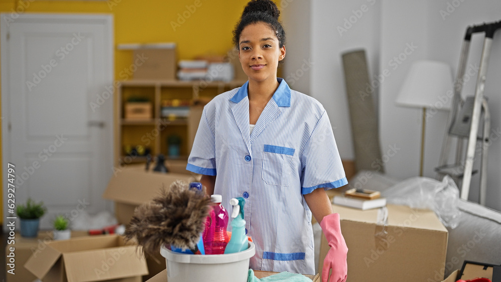 African american woman clean professional holding cleaner products ...
