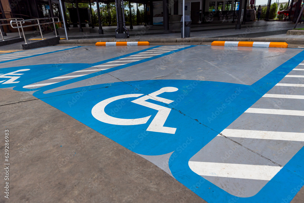 Parking for disabled or wheelchair. A sign indicates reserved parking ...