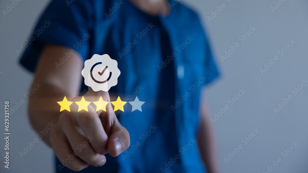Quality control. Businessman hand checking mark four star rating on ...