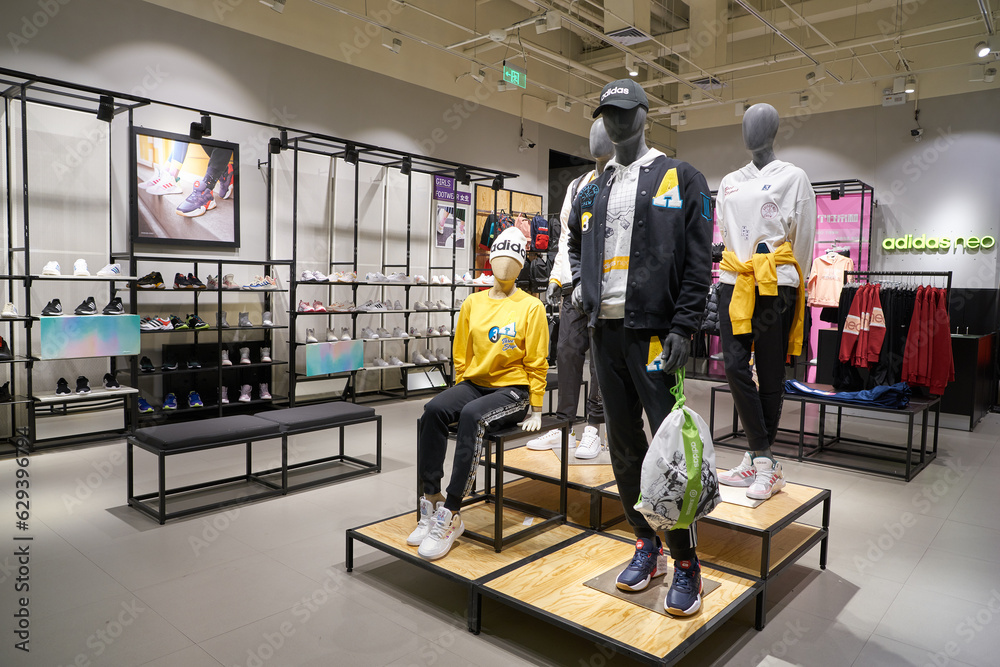 SHENZHEN, CHINA - NOVEMBER 21, 2019: dressed mannequins inside Adidas ...