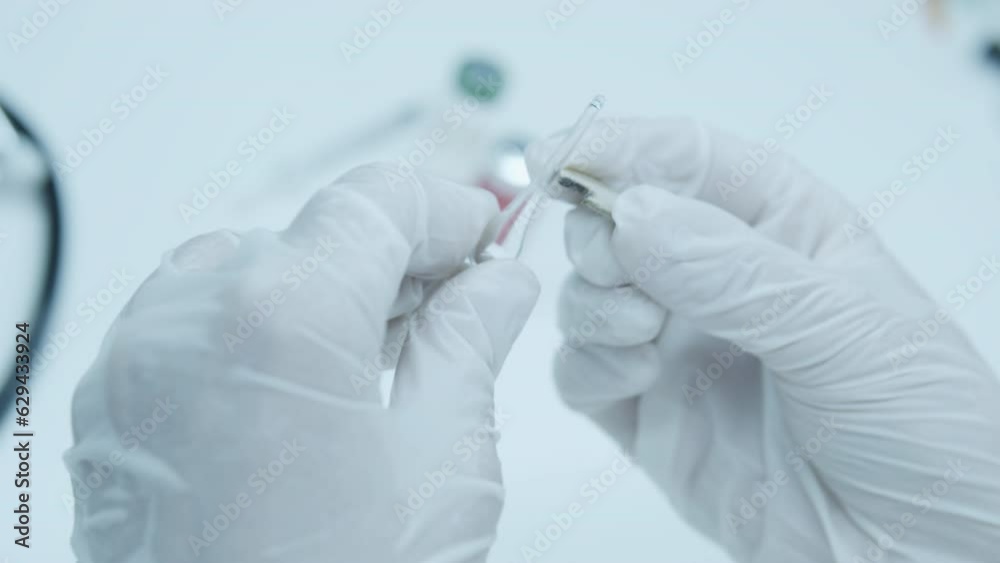 Close-up of a syringe and a glass jar of medicine. Vaccination. Disease ...