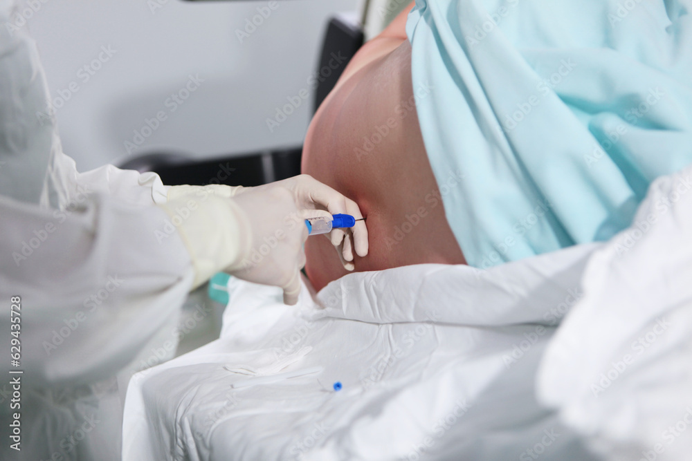Injections of epidural anesthesia in preparation for surgery ...