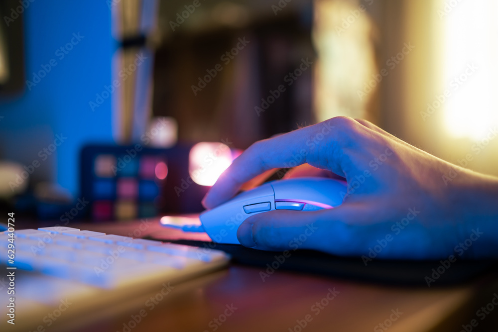 Professional gamer playing computer game with gaming mouse Stock Photo ...