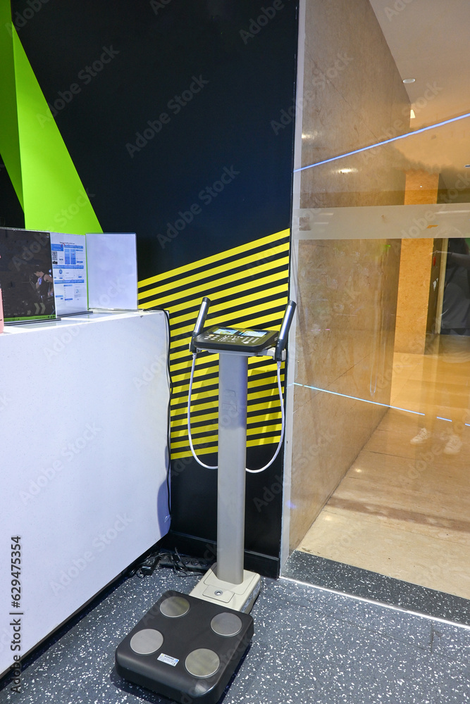 Body fat analysis with electronic bioelectrical impedance scale at gym ...