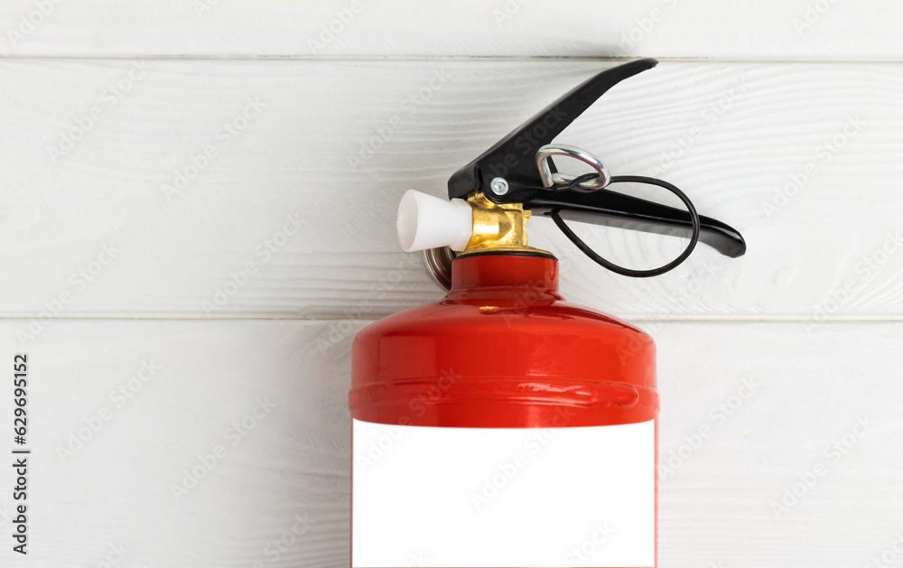 Fire extinguisher on a white texture background. Fire protection, home ...