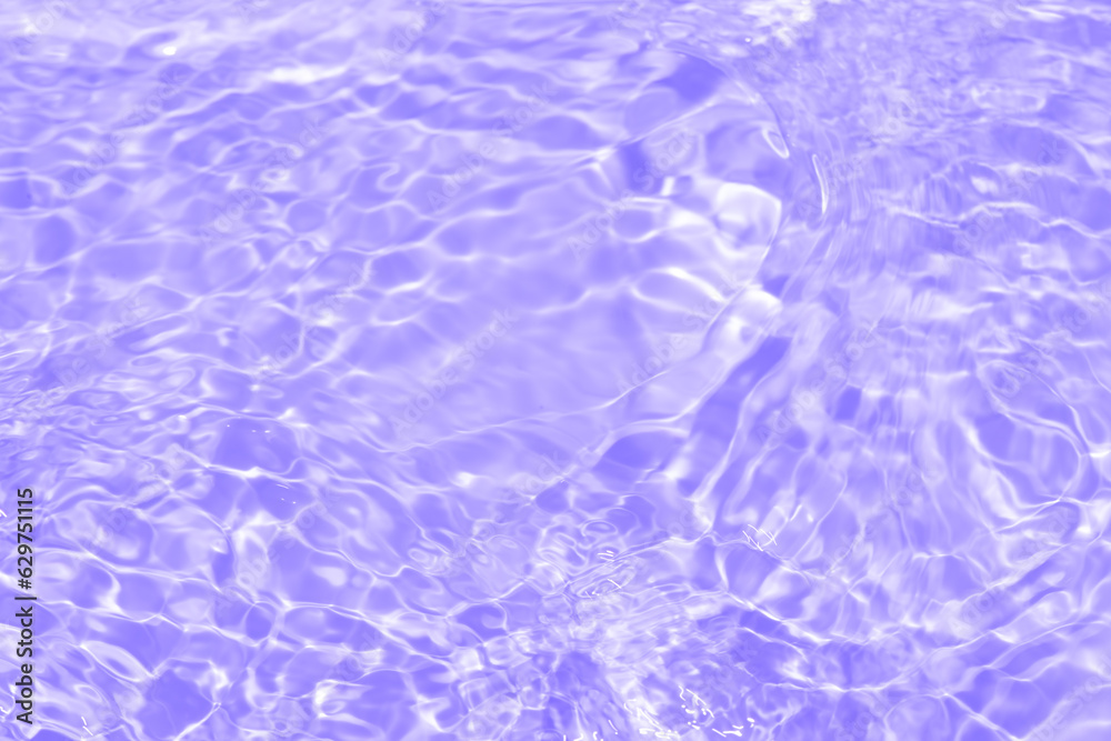 Purple water with ripples on the surface. Defocus blurred transparent ...