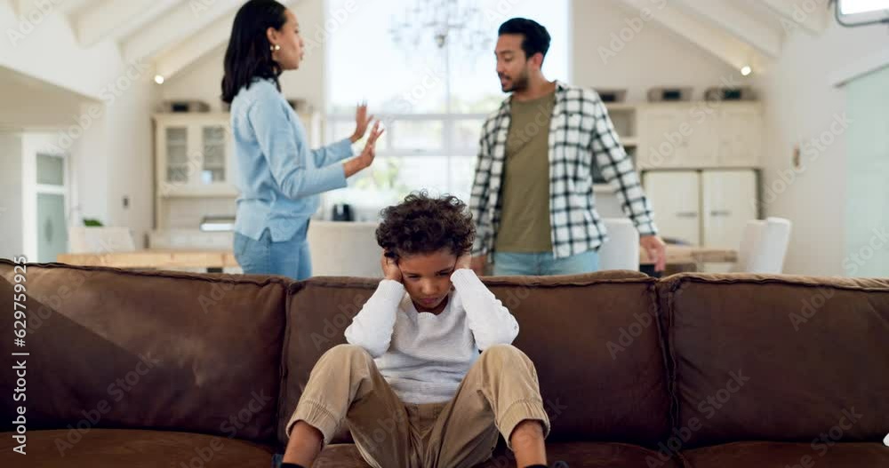 Divorce, fear and a boy with parents fighting in the home during ...