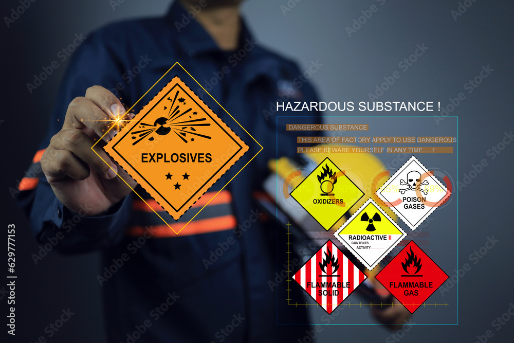 cargo staff or product inspector writing on explosives warning sign and ...