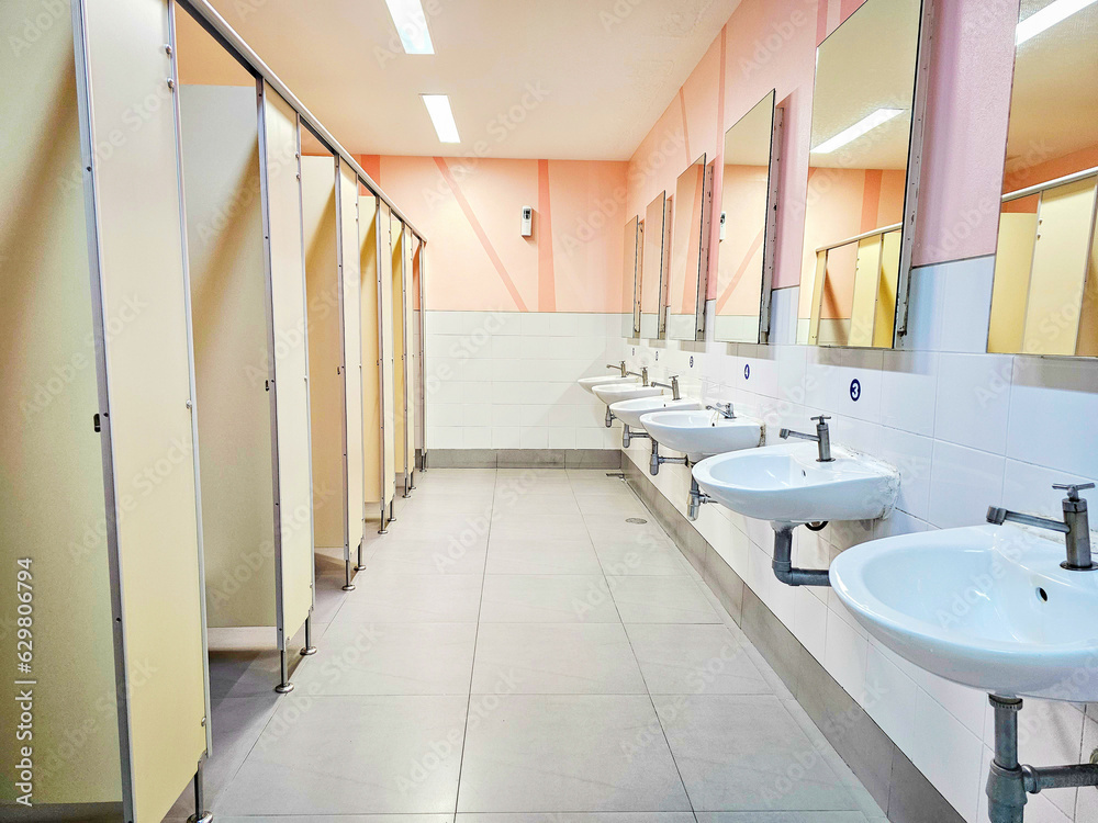 Row of public toilet, restroom, lavatory, water closet and white ...