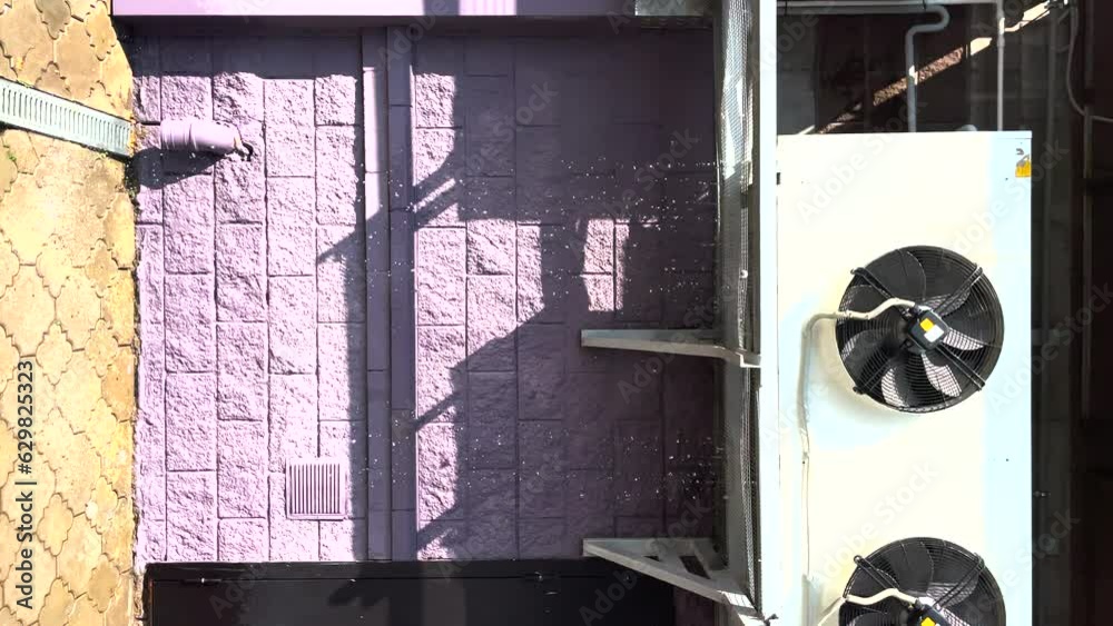 Vertical shot of air conditioning system installed on wall above the ...