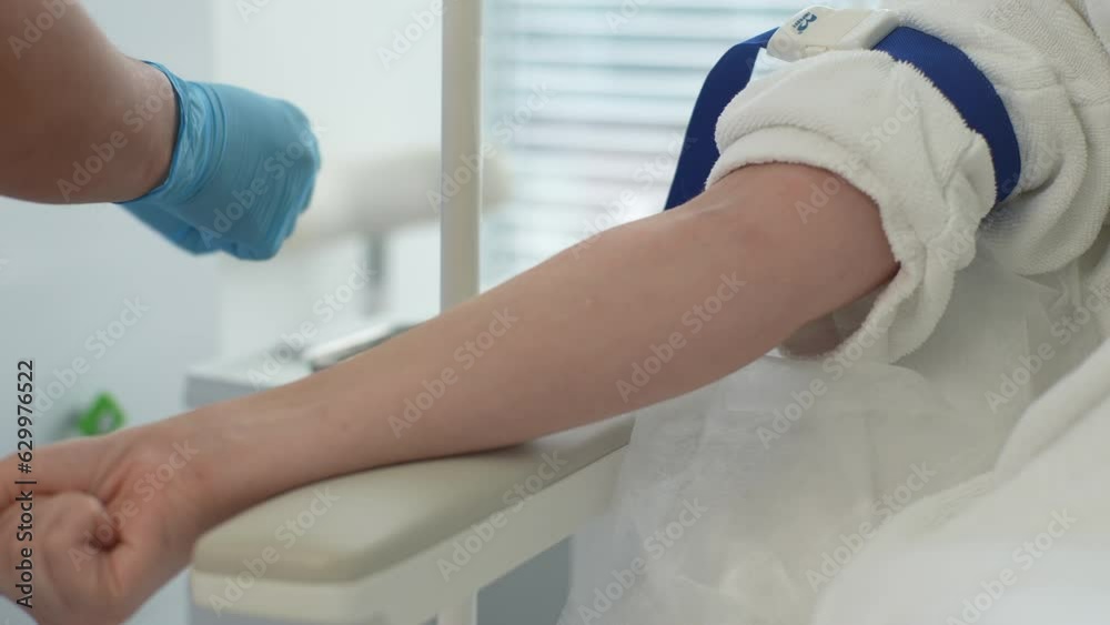 Close-up cropped shot of unrecognizable female nurse in medical gloves ...