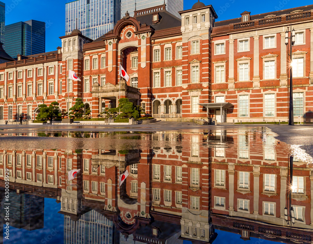 Reflection of the 1800s era red brick Tokyo Station building in water ...