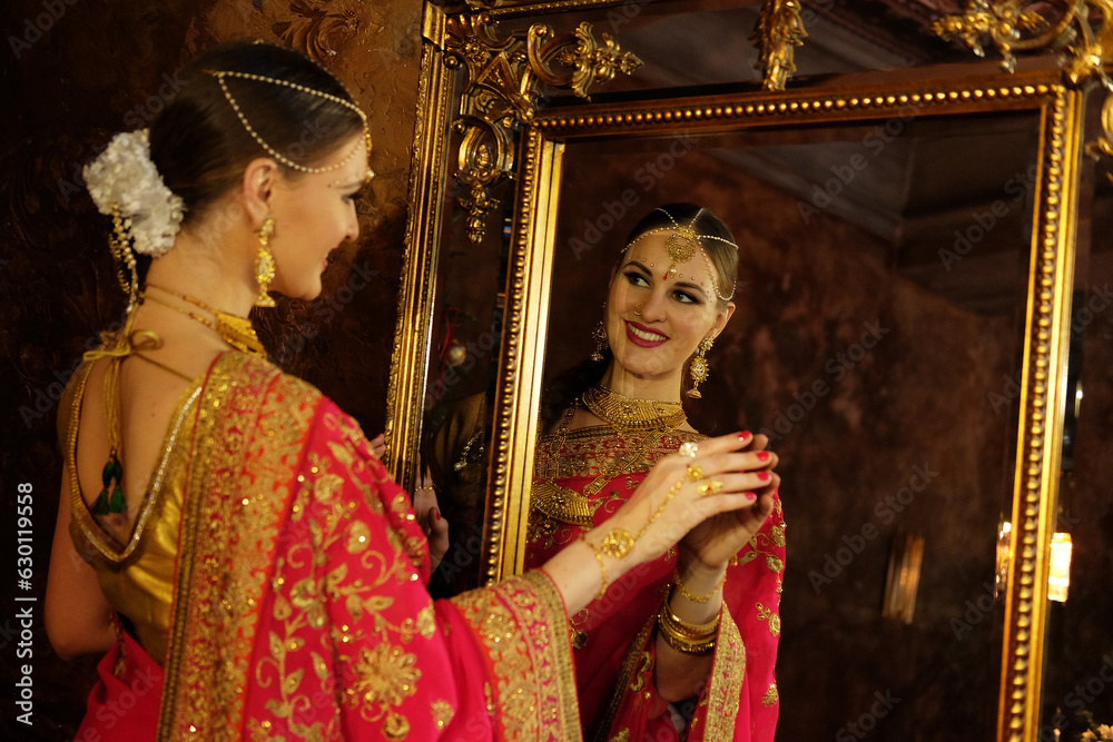 Female model Hindu Bride in saree, wearing gold and jasmine flower ...