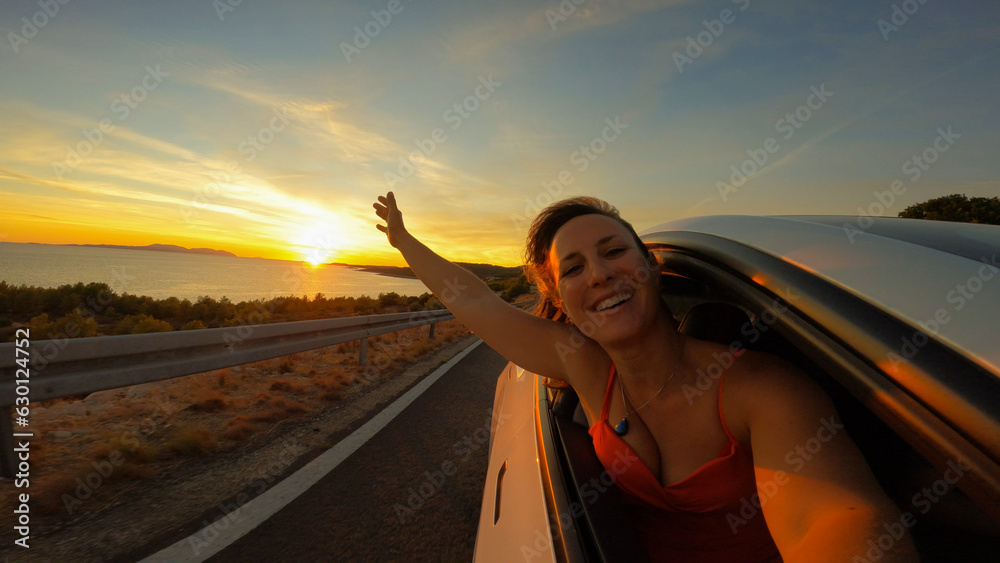 PORTRAIT, LENS FLARE: Happy lady smiles through window of a car driving ...