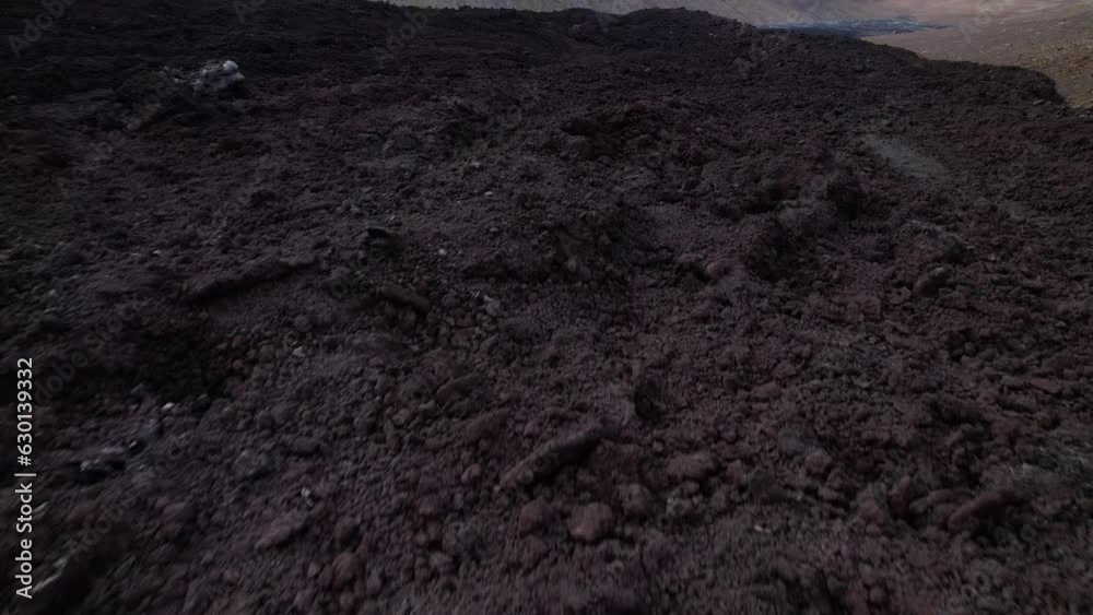 DRONE AERIAL FOOTAGE: View of cracked lava crust or ingenious rock and ...