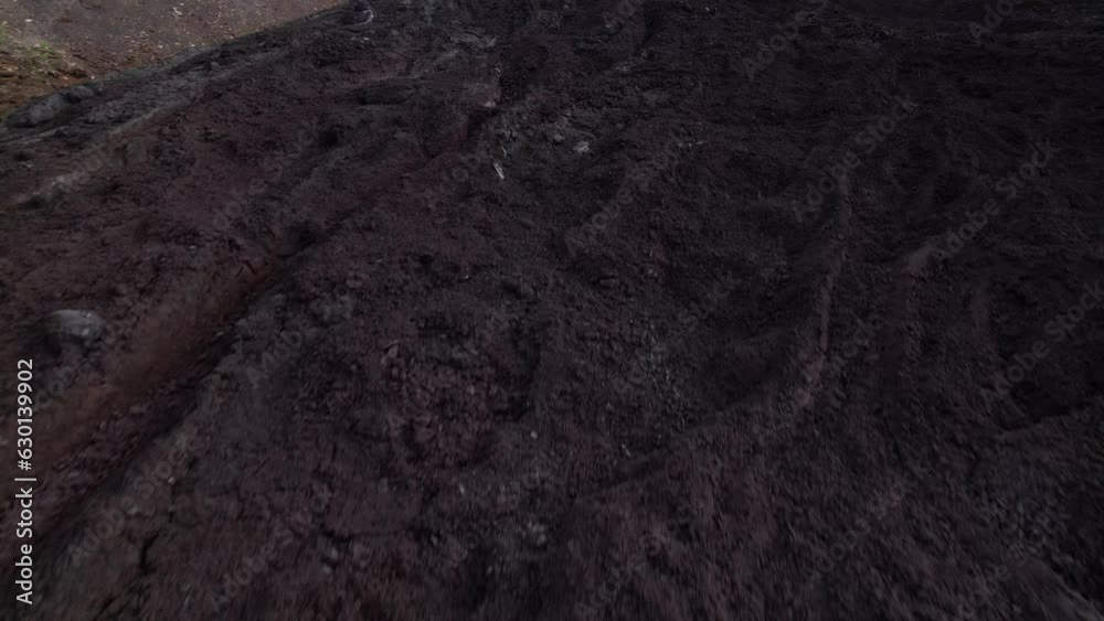 DRONE AERIAL FOOTAGE: View of cracked lava crust or ingenious rock and ...