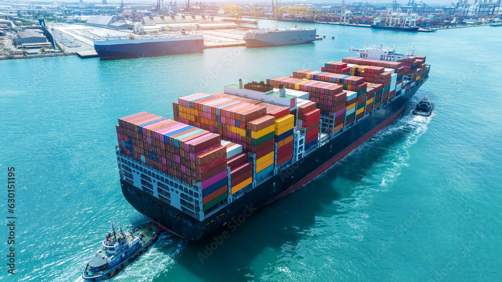Stern of large cargo container ship import export container box on the ...