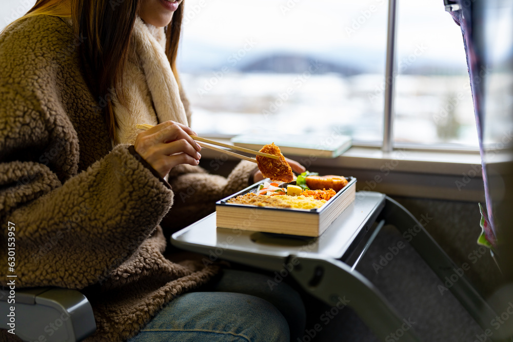 Asian woman eating traditional Japanese pork cutlet with rice Tonkatsu ...