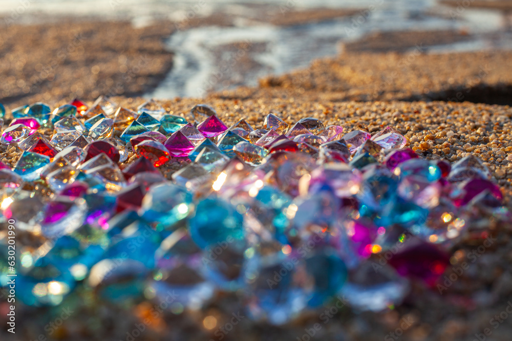 Colorful diamonds on the beach..Each diamond caught the glimmer of the ...