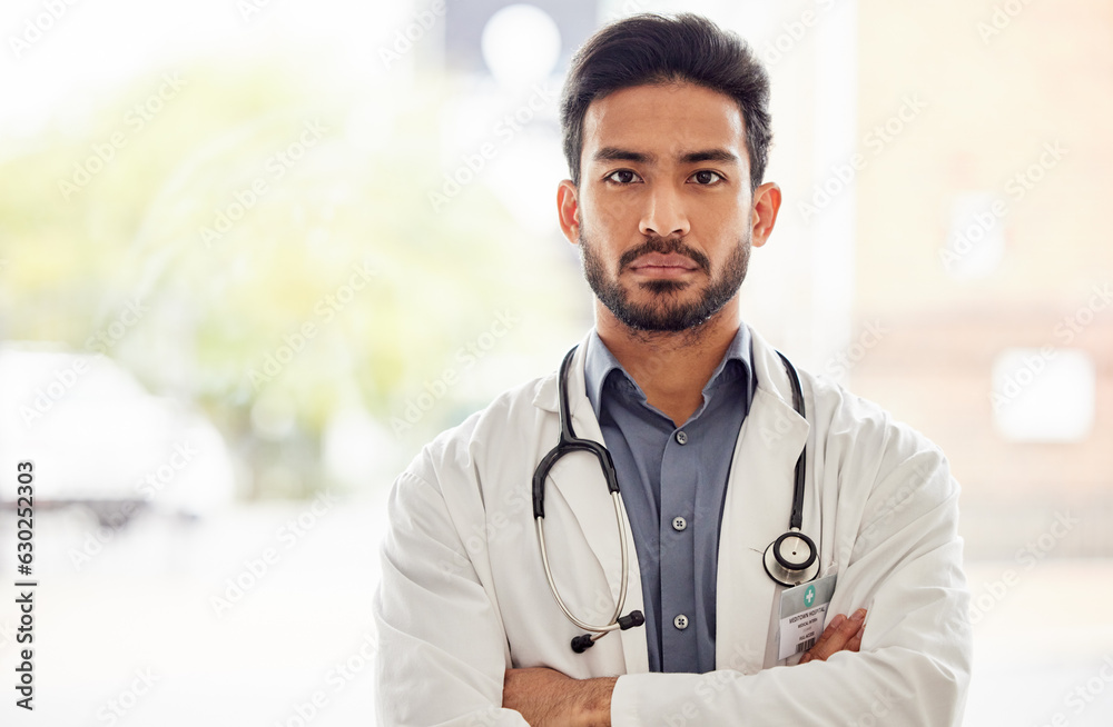 Arms crossed, serious and man doctor portrait in hospital with ...