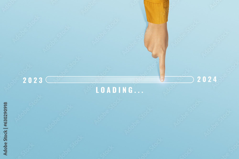 Man hand touching loading bar for countdown to 2024. Loading year 2023 ...
