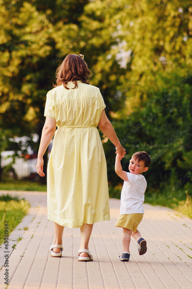 Child feels a mix of emotions as he looks back at his mom, unsure of ...