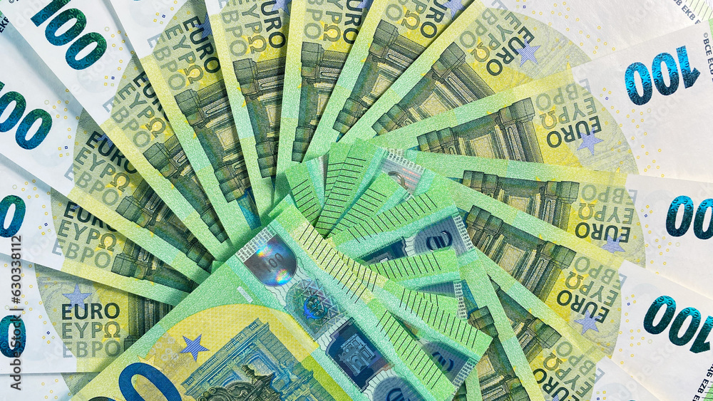 The 100 euro bills are in the shape of a circle. Cash banknotes of one ...