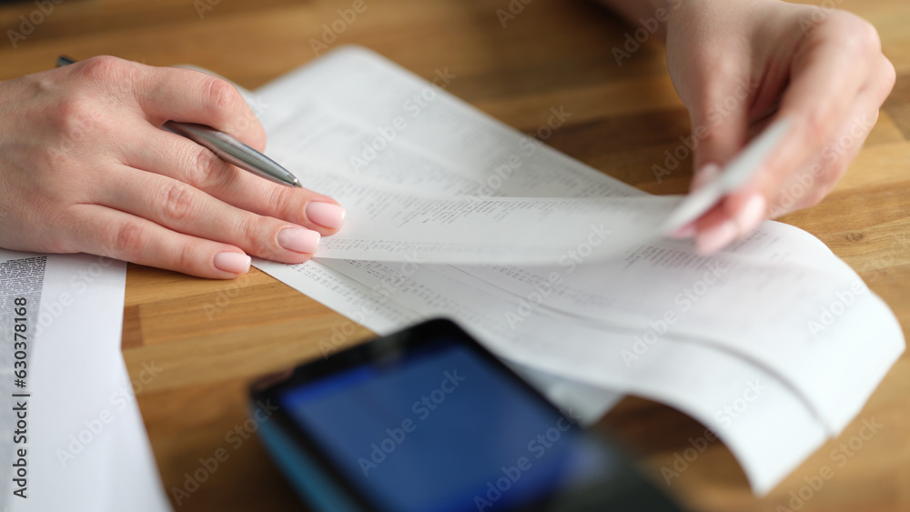 Credit card processor with paper invoice and touch screen. Woman ...