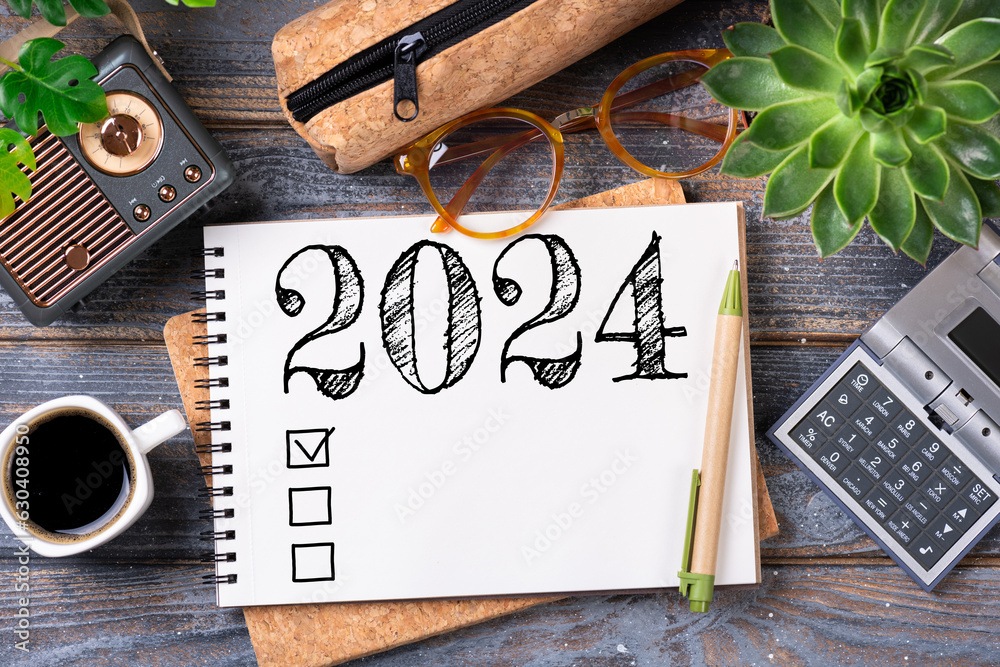 New year resolutions 2024 on desk. 2024 goals list with notebook ...