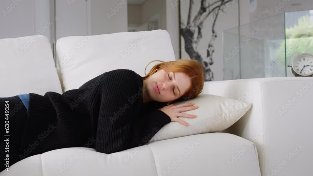 Bored young sleepy woman falls down on sofa. Apathetic tired lazy ...