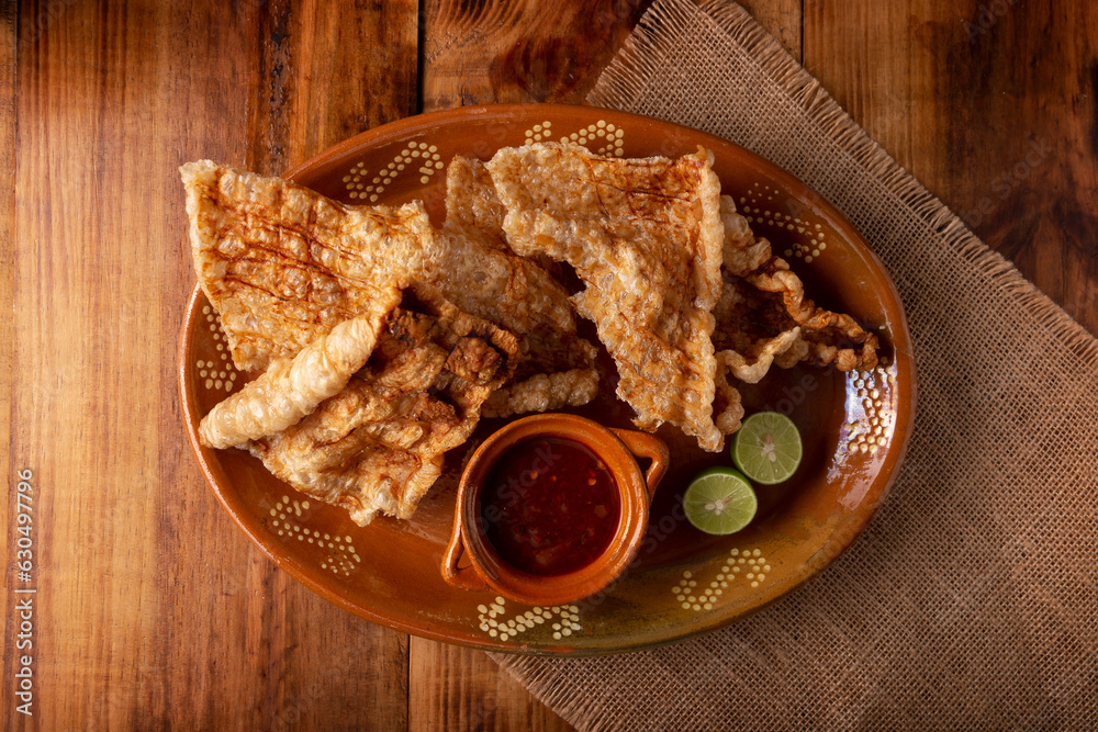 Chicharron. Crispy Fried pork rind, are pieces of aired and fried pork ...