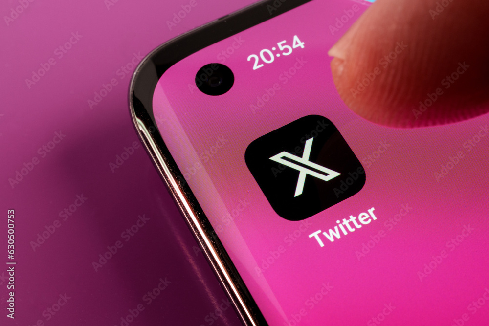 Twitter X app logo seen on screen of smartphone. Twitter rebrands as X ...