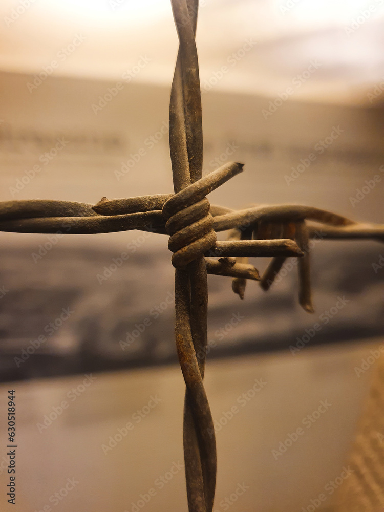 At Schindler's factory in Poland, barbed wire fences separate ...