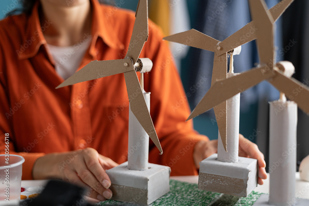 Closeup of windmill props with woman on background. House and wind ...