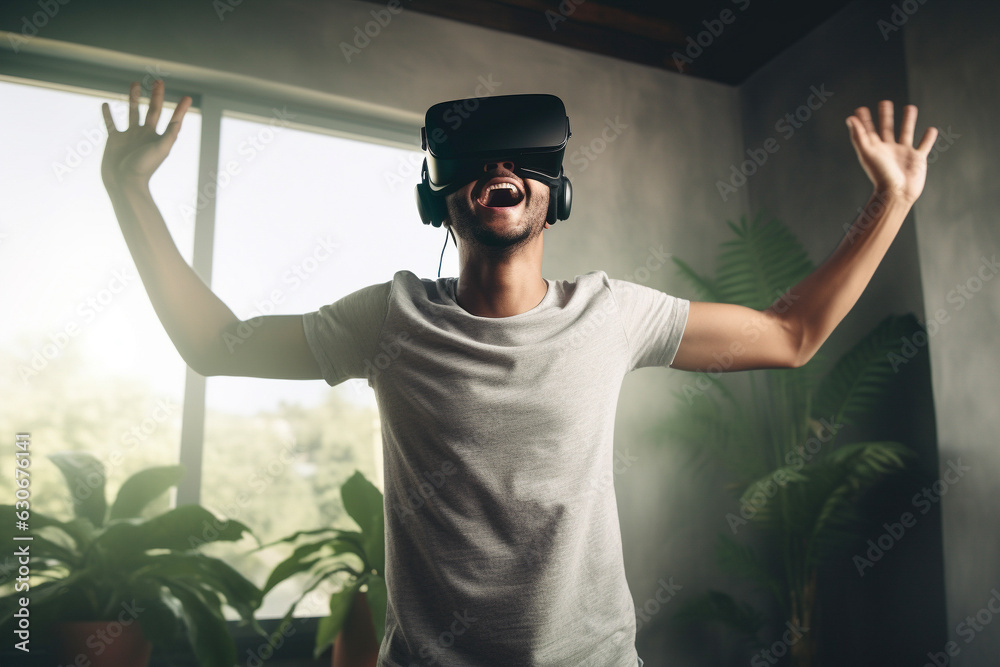 Excited young man using Virtual Reality headset device at home - Amazed ...