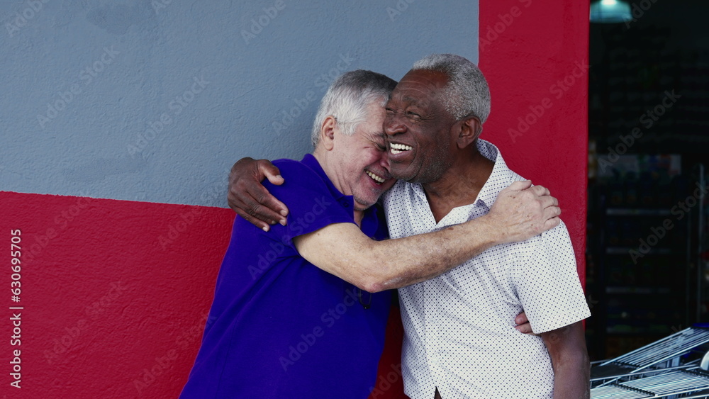 Authentic Interaction of Two Happy Diverse Older Friends, Hugging and ...